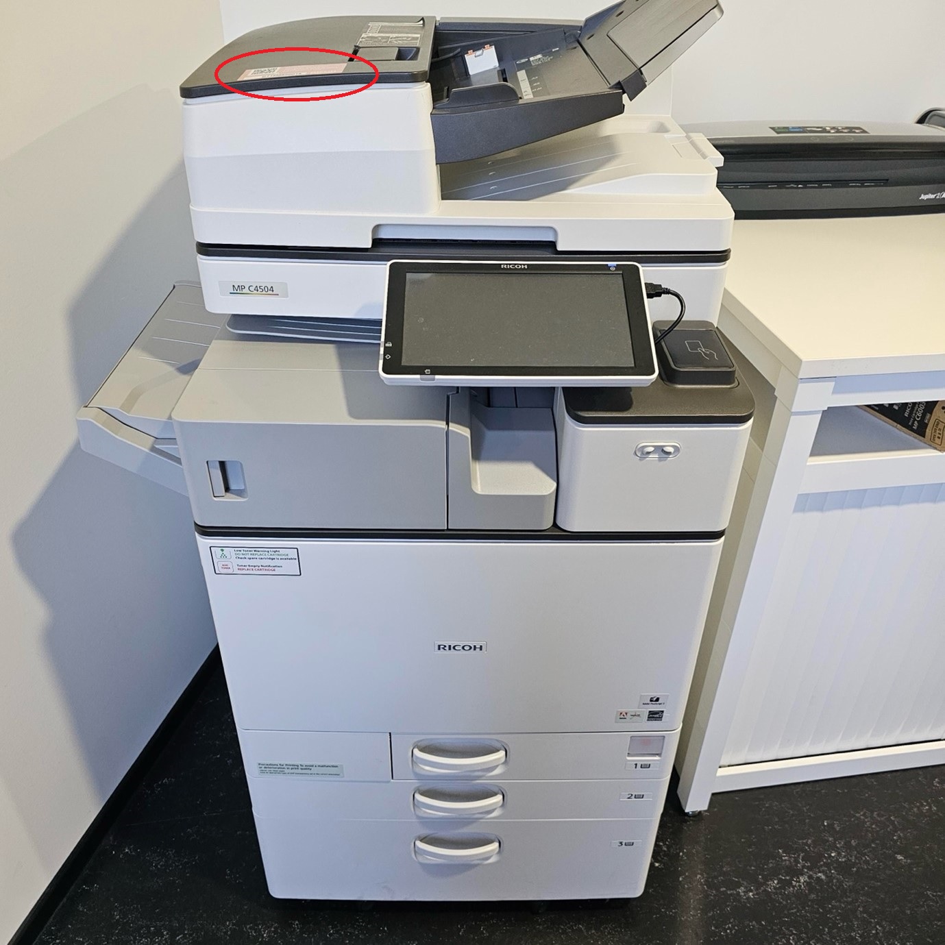 Where do I find the serial number on a multifunction device (MFD ...